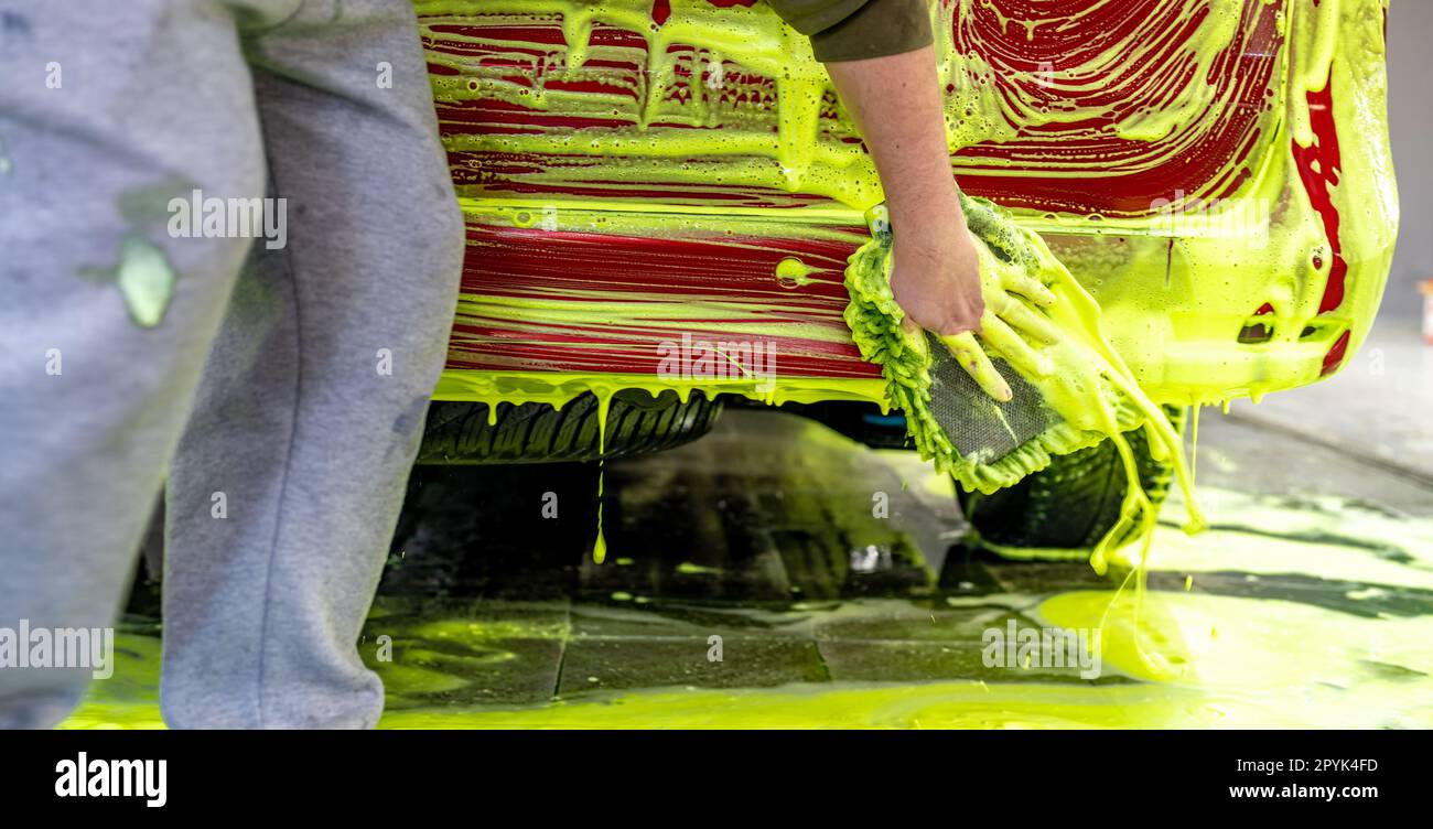 wash cars with green active foam in the garage Stock Photo - Alamy