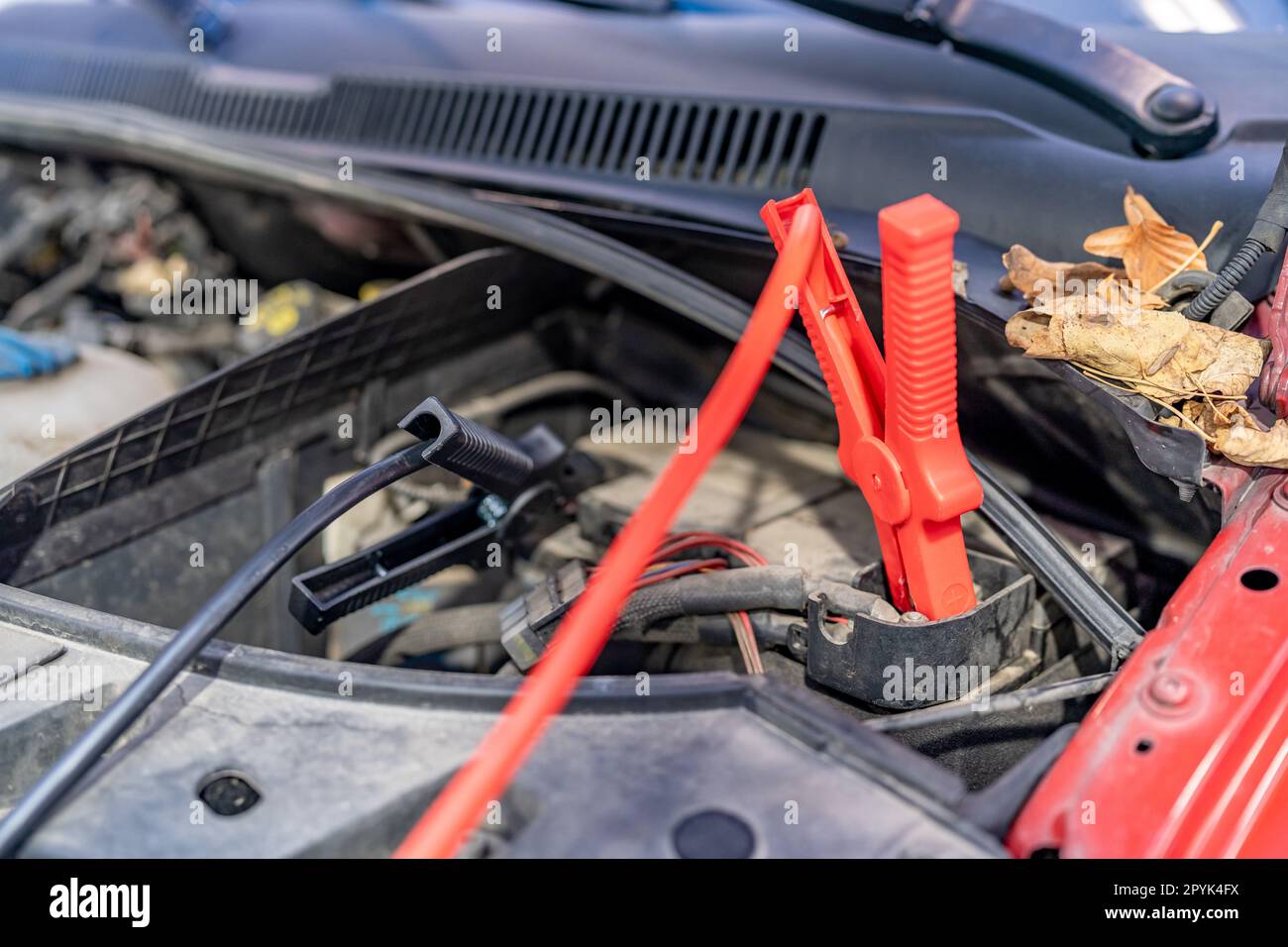 charging the car battery using electric cables Stock Photo - Alamy