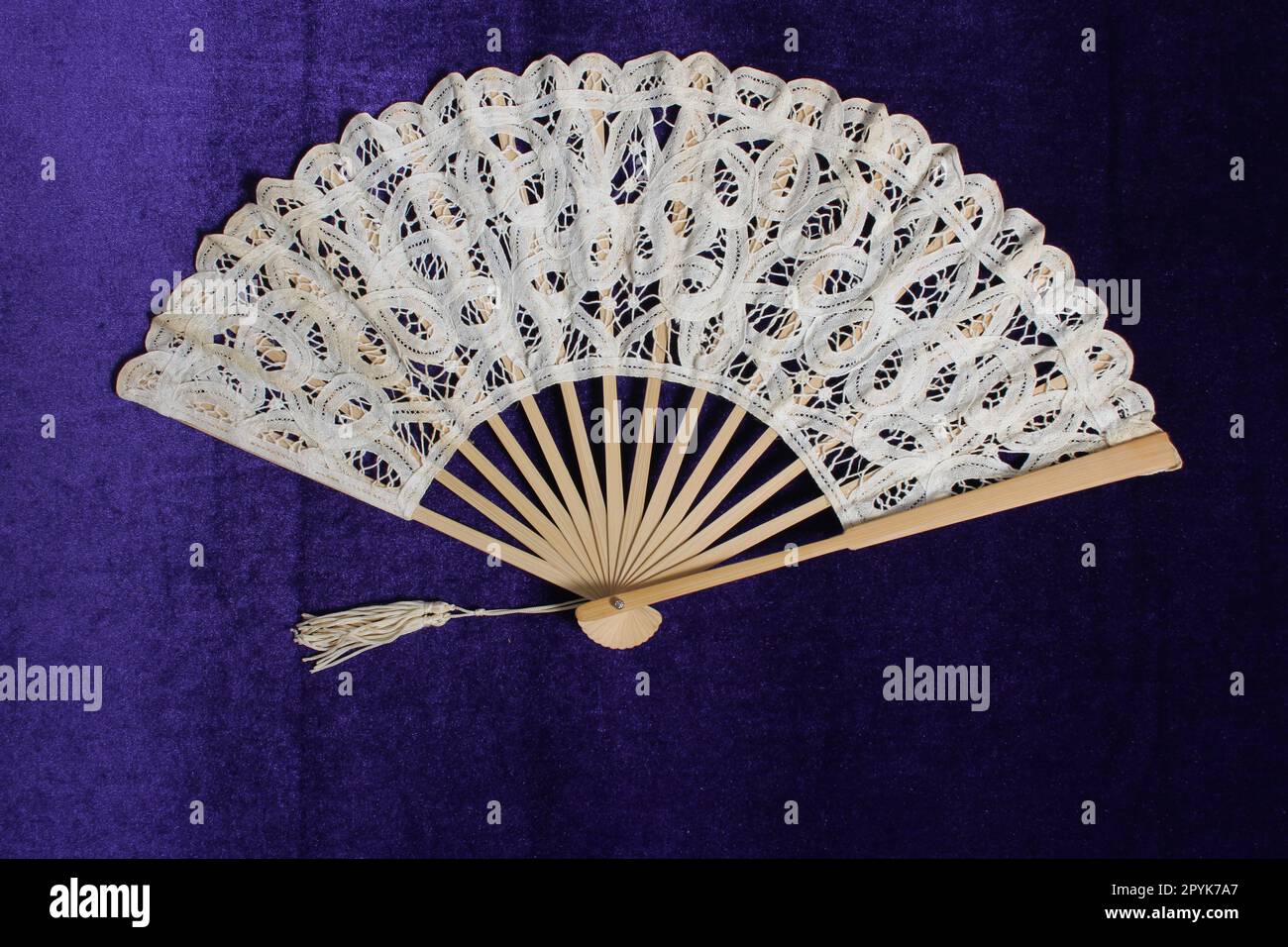 Vintage Lace Hand Fan On Purple Velvet Background Stock Photo - Alamy