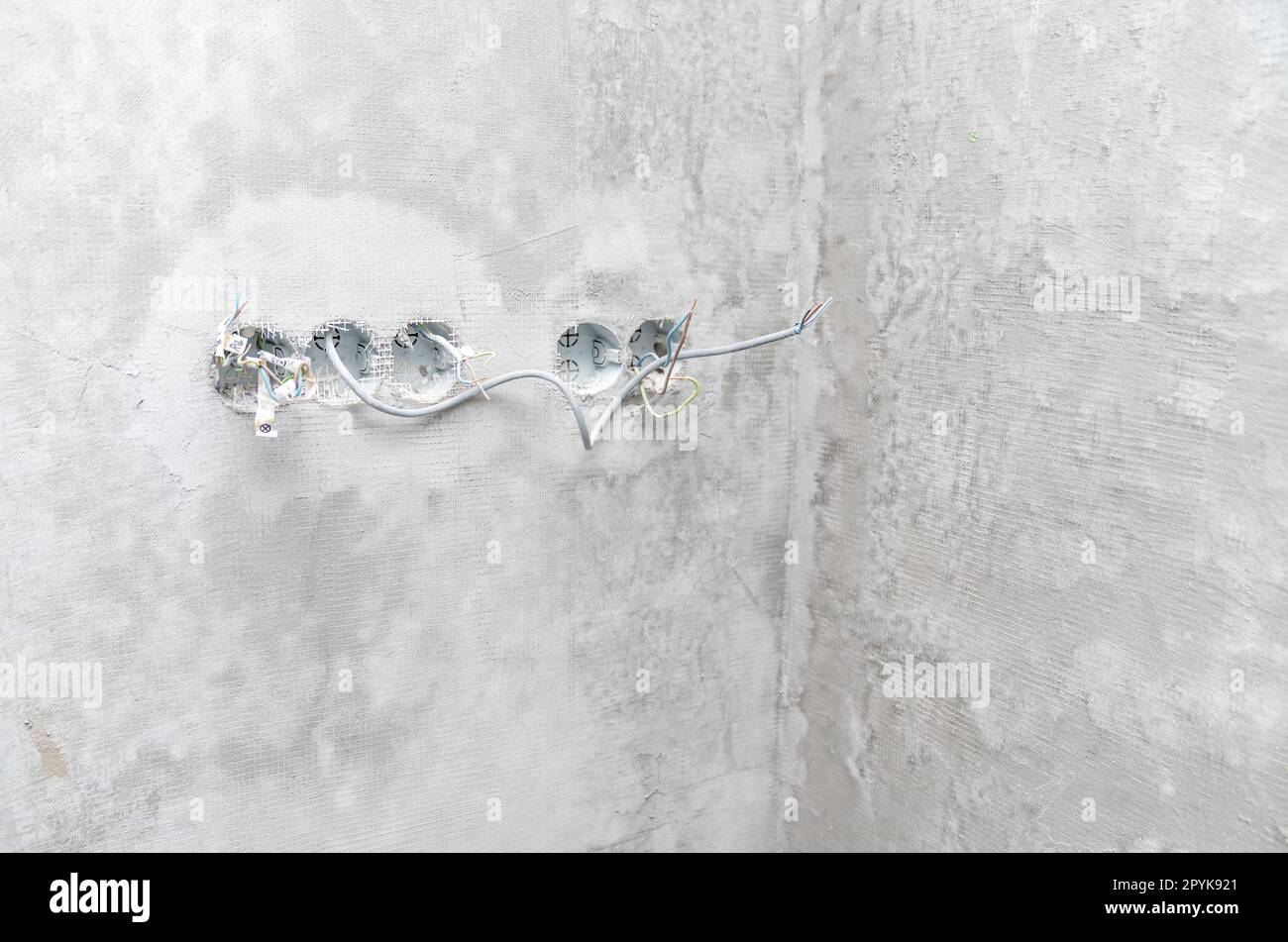 electrical wires in the wall at the construction site Stock Photo - Alamy