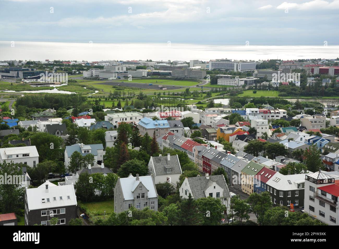 Aerial view of colorful buildings and lush greenery of Reykjavik ...