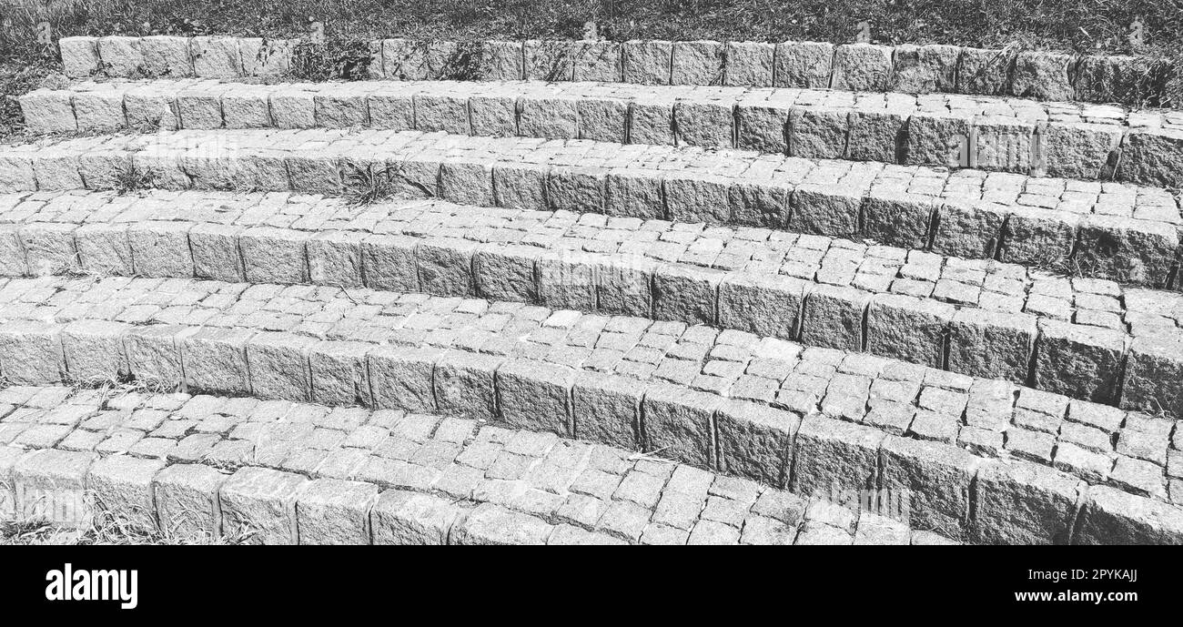 Semicircular steps of the amphitheater. Wide staircase made of stone ...