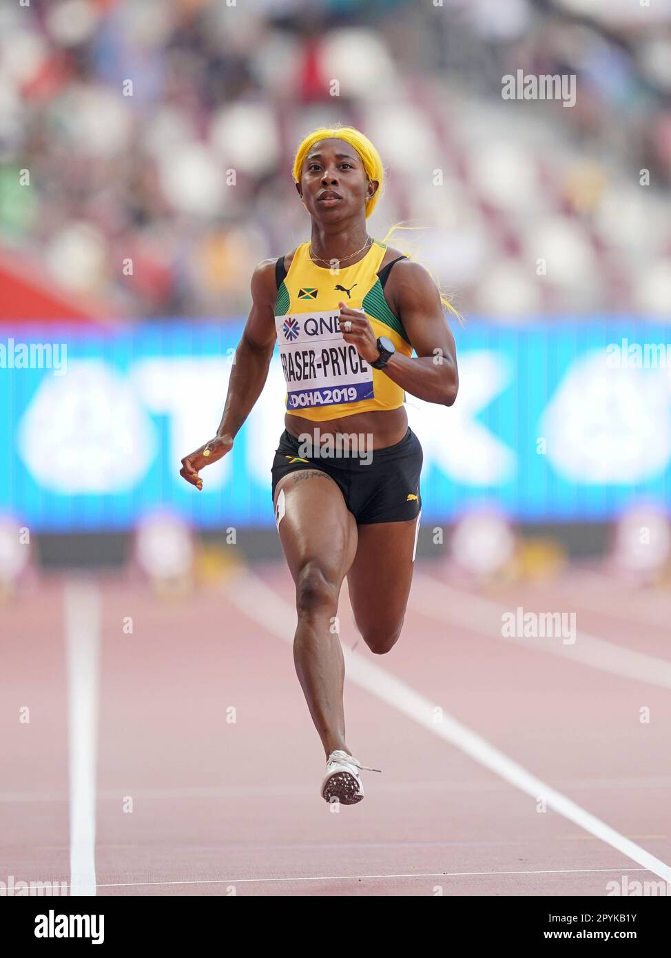 Shelly-Ann Fraser-Pryce running the 100m at the 2019 World Athletics ...