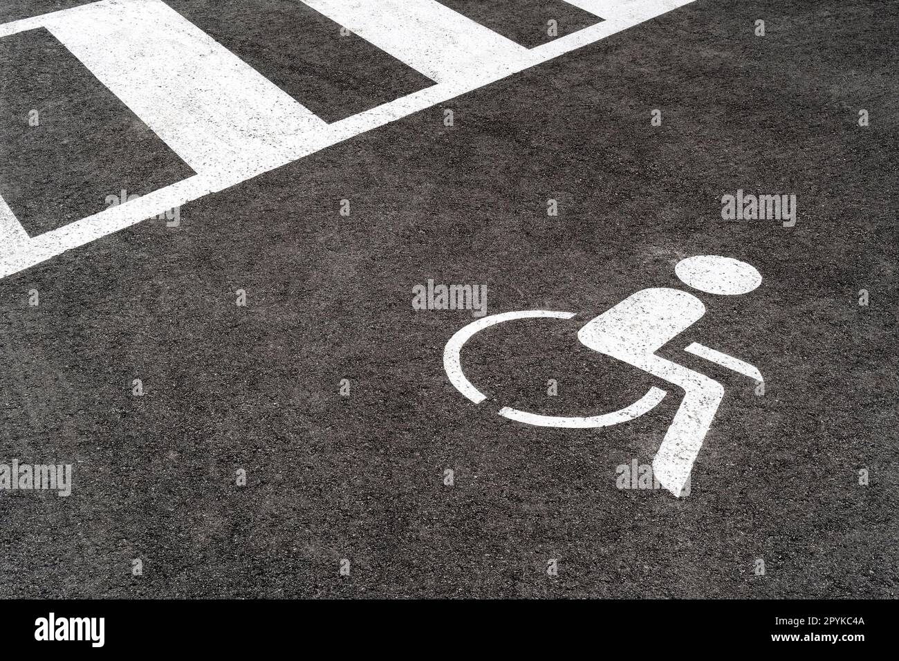 Disabled parking sign on the road Stock Photo - Alamy
