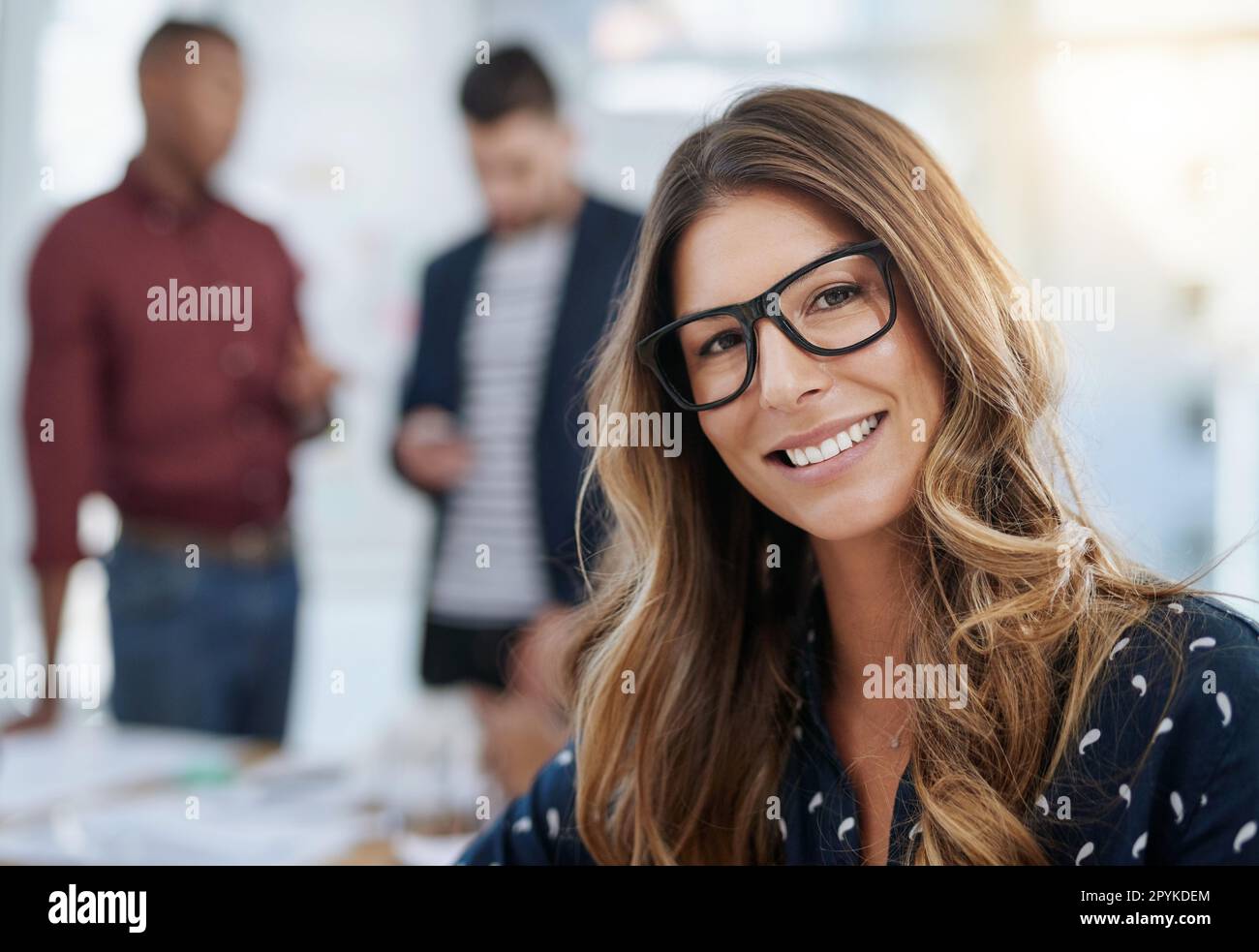 Hard work is happiness for her. creative employees working in a modern ...