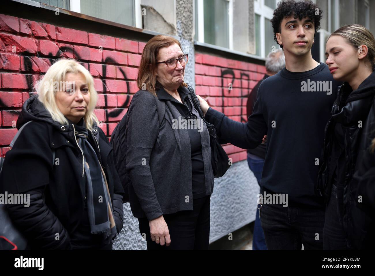 People mourn the victims near Vladislav Ribnikar school in Belgrade ...