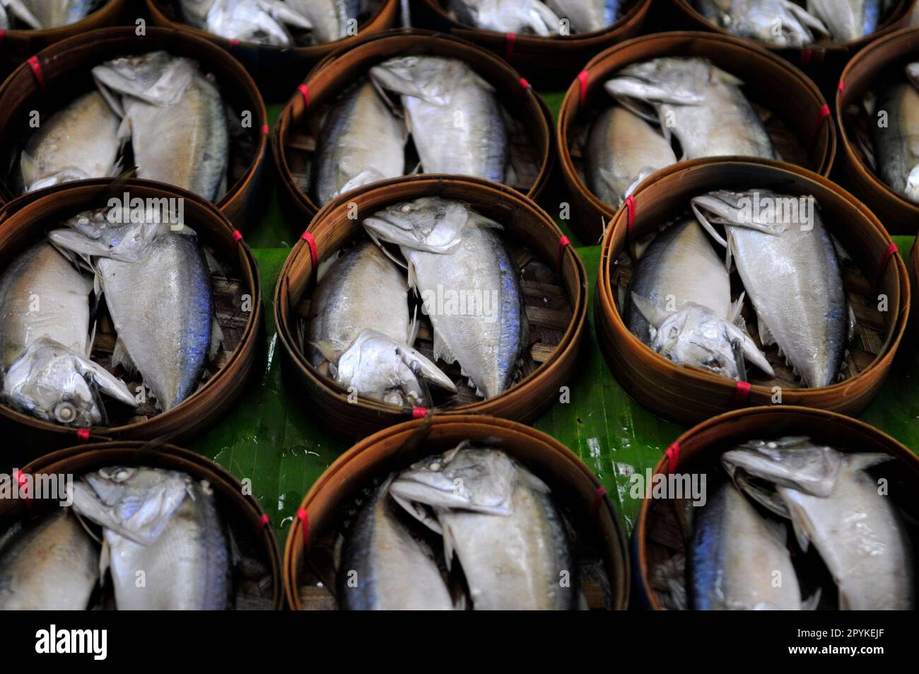 Steamed Thai Mackerel fish from Gulf of Thailand in bamboo basket for ...