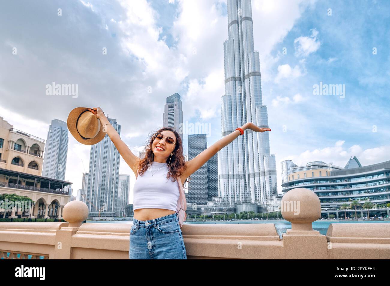 happy traveler girl with outstretched arms, embracing the incredible ...