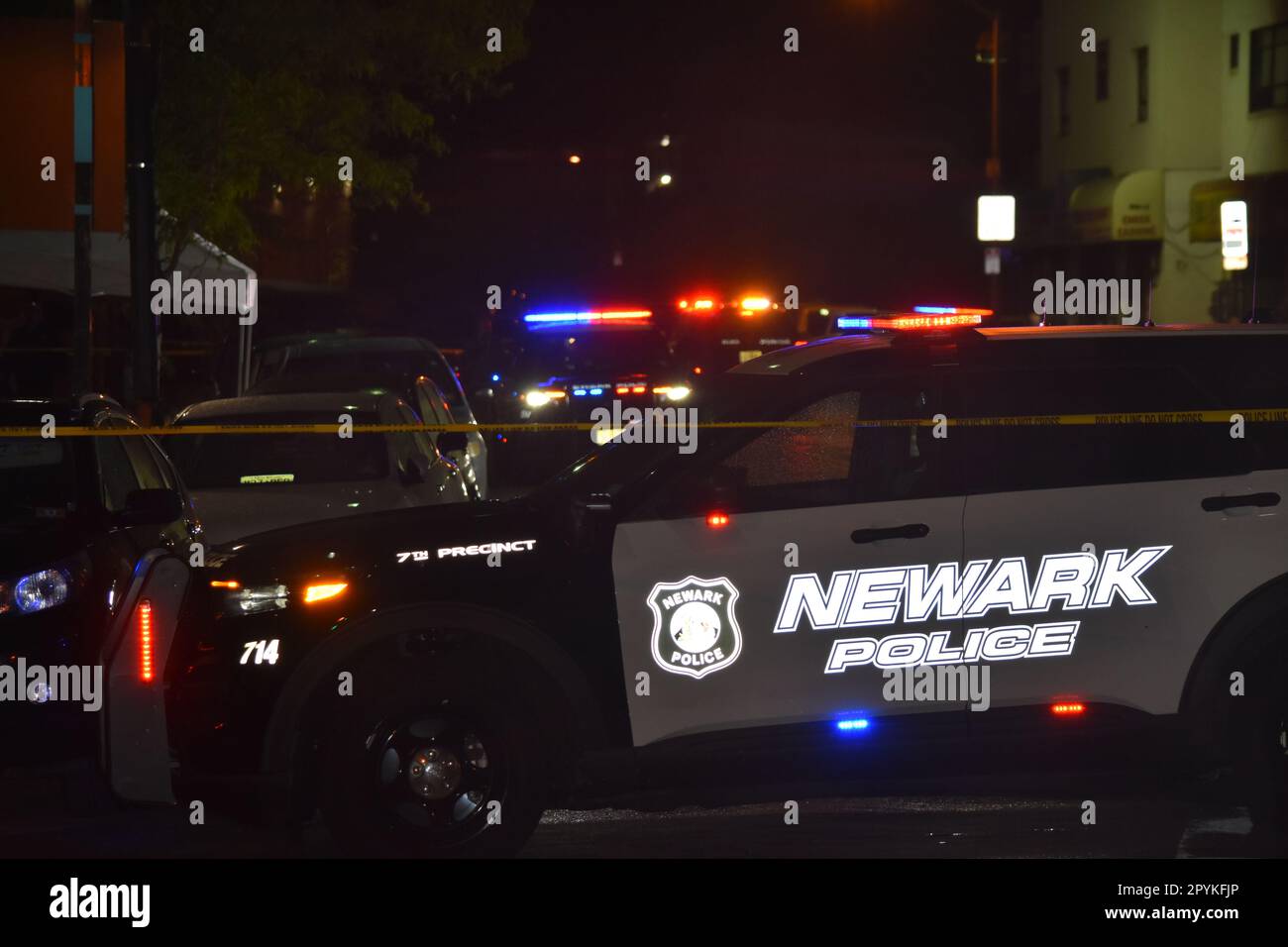 Police vehicles at the crime scene. Four people including a child were ...