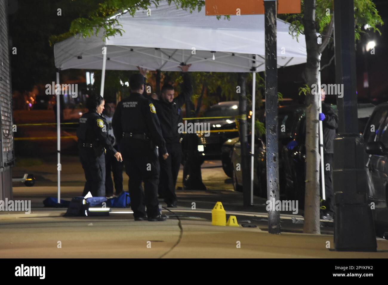 Investigators Gather Clues At The Scene Of The Crime Four People