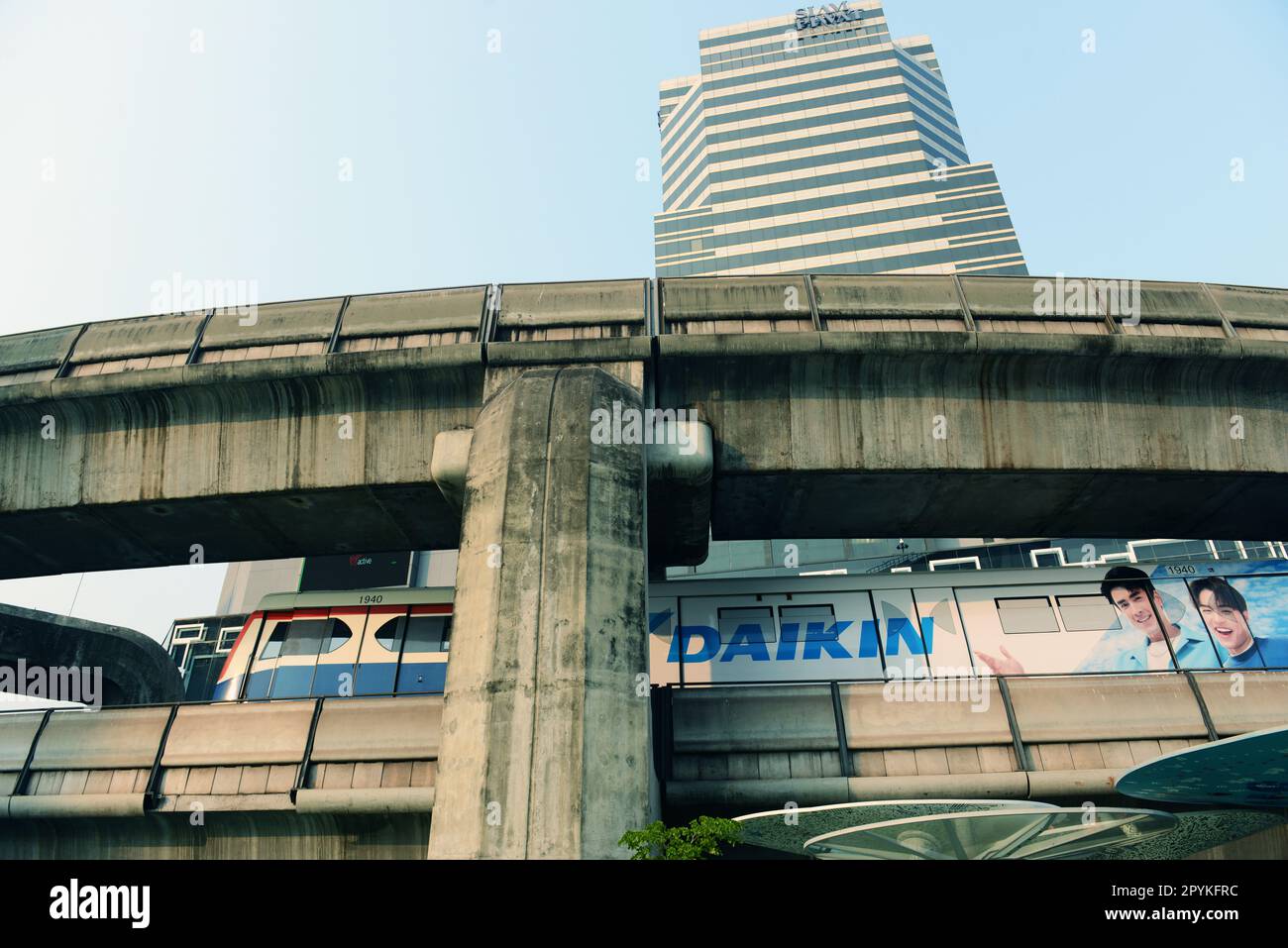 Walking on the OneSiam skywalk between MBK shopping center and Siam ...