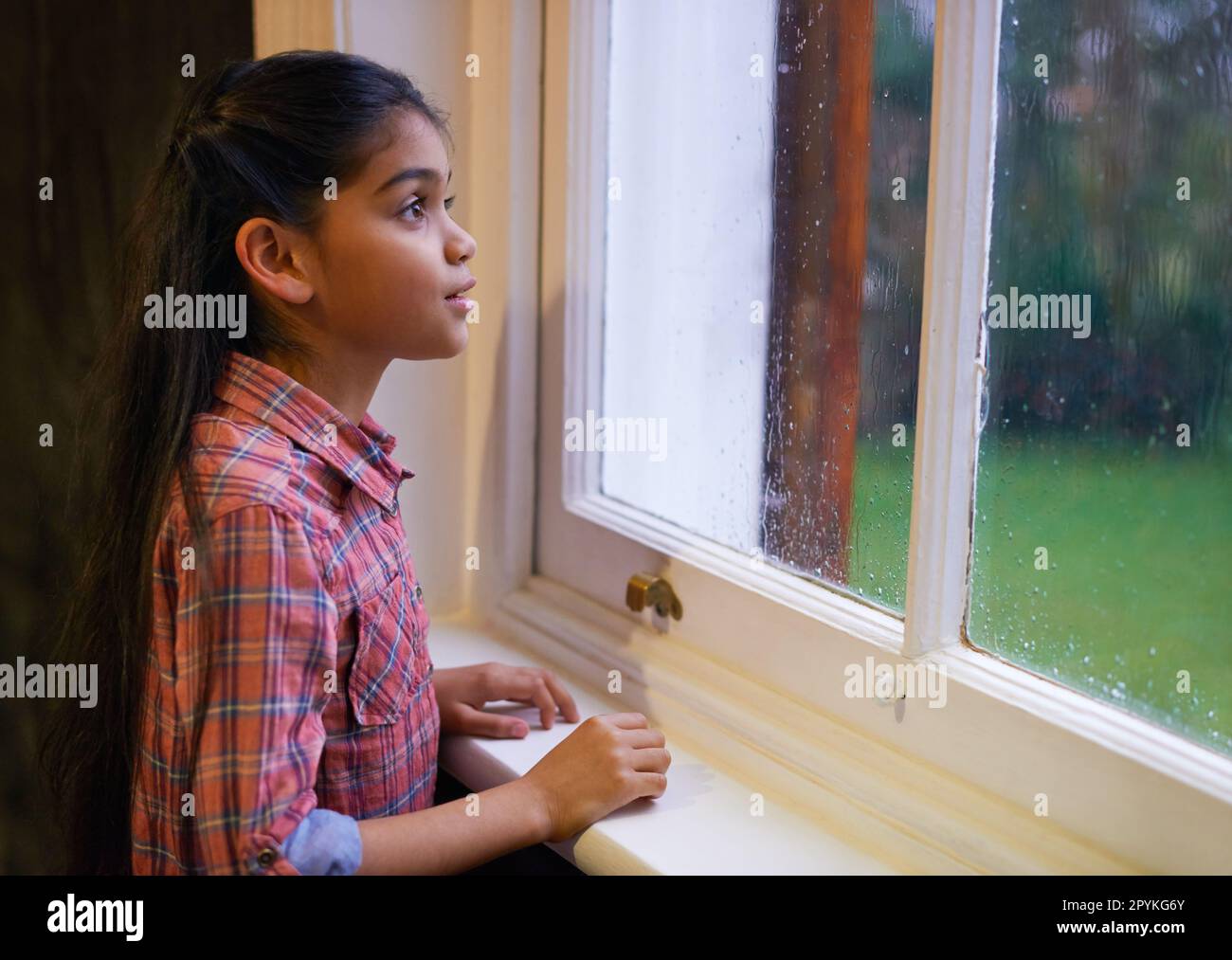 Rain, window and girl with ideas, thinking or wonder with thoughts ...