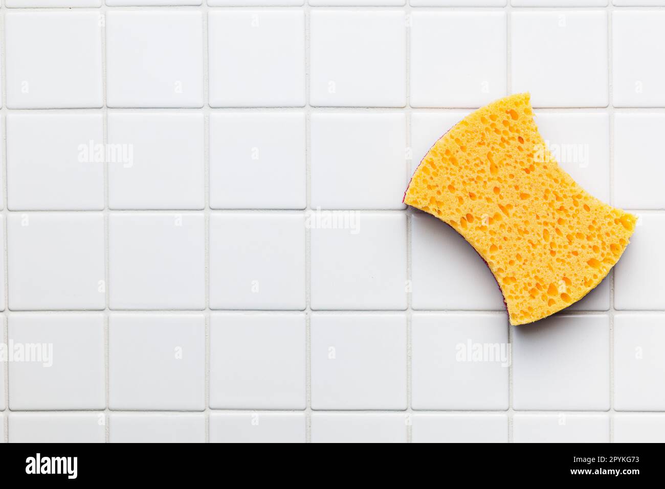 Sponges for washing dishes on the tiles. Top view Stock Photo - Alamy