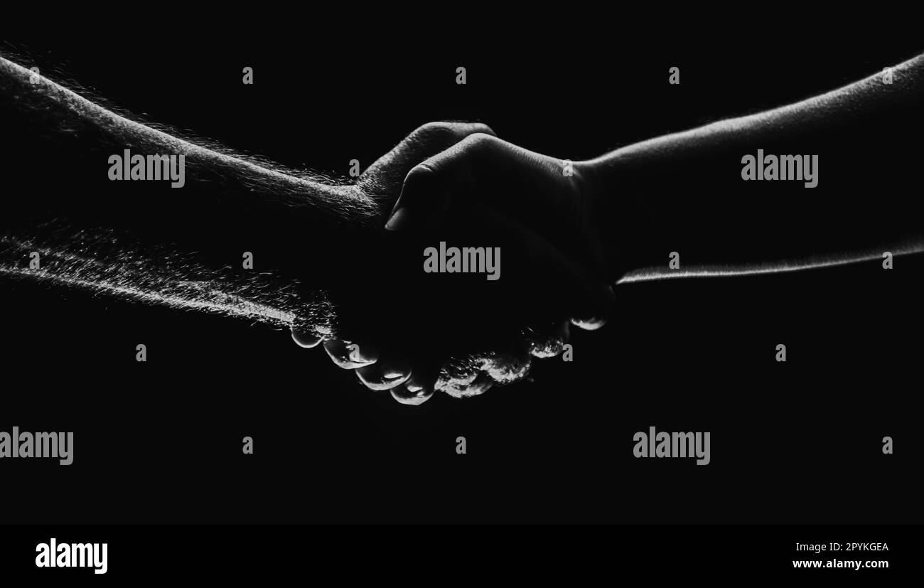 Handshake between the two partners, agreement. Male hands rescue ...