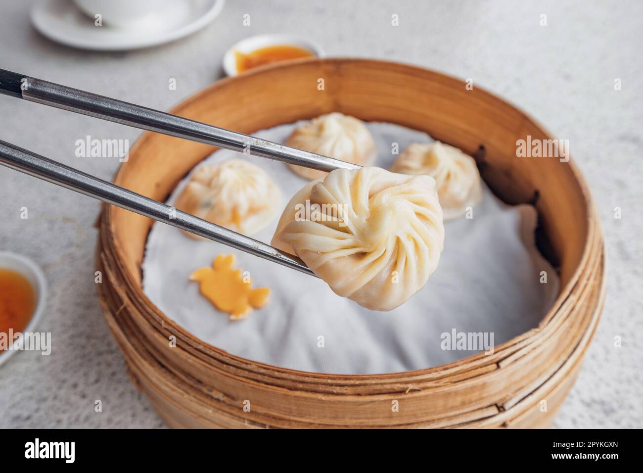 A sumptuous spread of Xiao Long Bao dumplings arranged beautifully in a ...