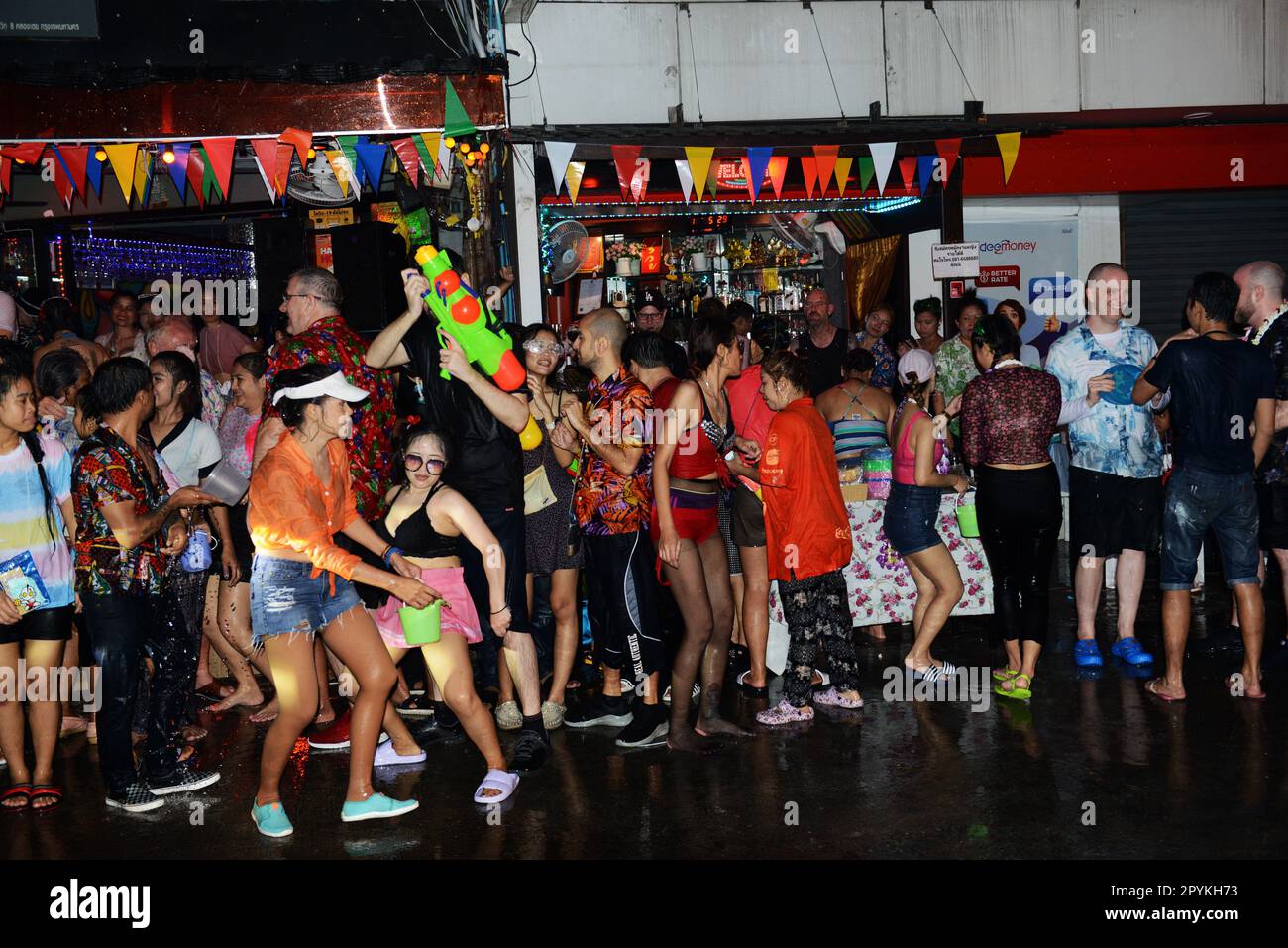 Celebrating Songkran ( Thai New Year ) by the bars on Soi 8 of ...