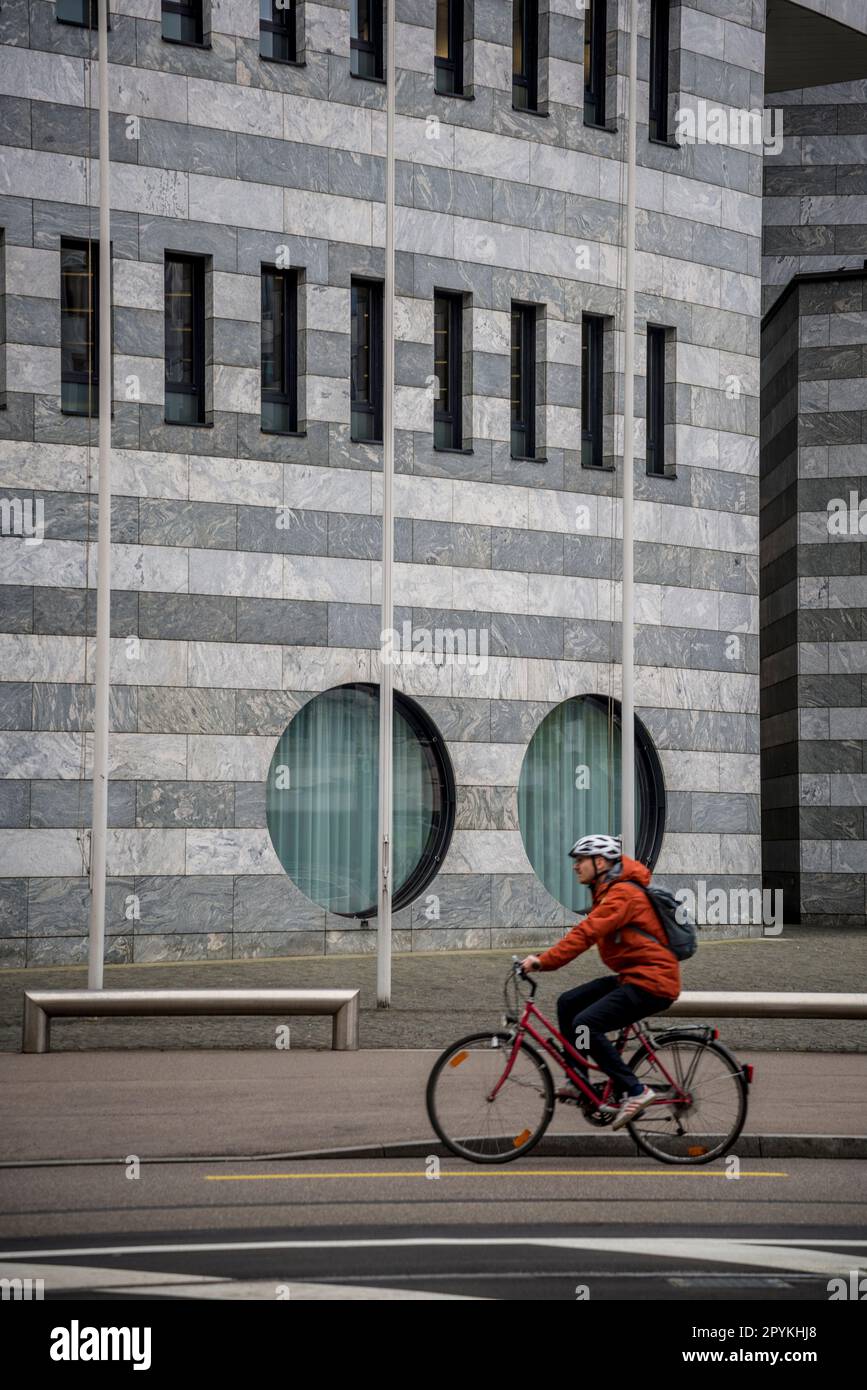 Cyclist passing by BIZ building which was designed by Mario Botta ...