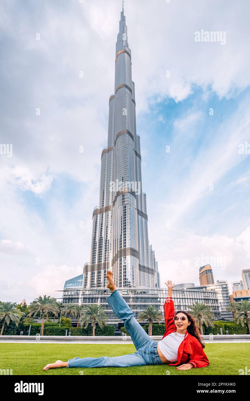 happy funny girl lying on a grass and enjoying incredible view of ...