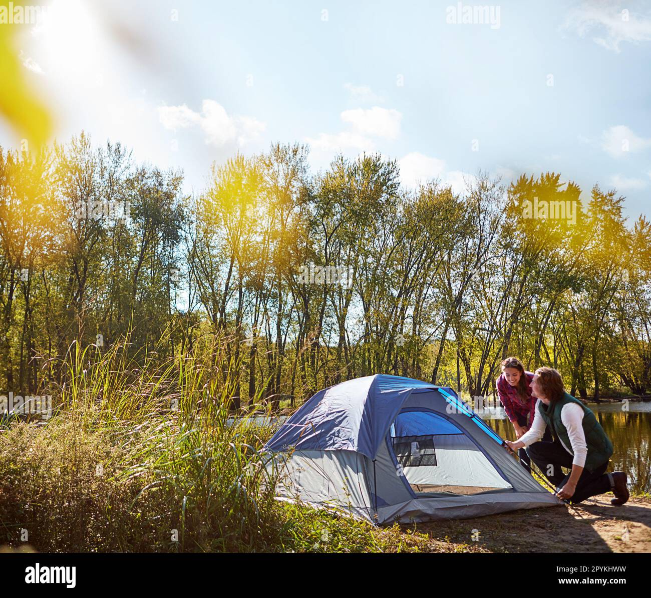 Its time to elevate your camping game. an adventurous setting up their ...