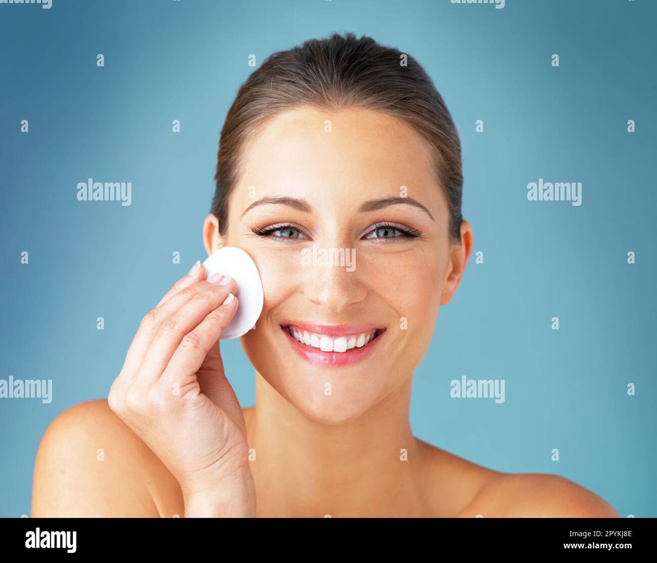 Removing the day of makeup away. Studio portrait of a beautiful young ...