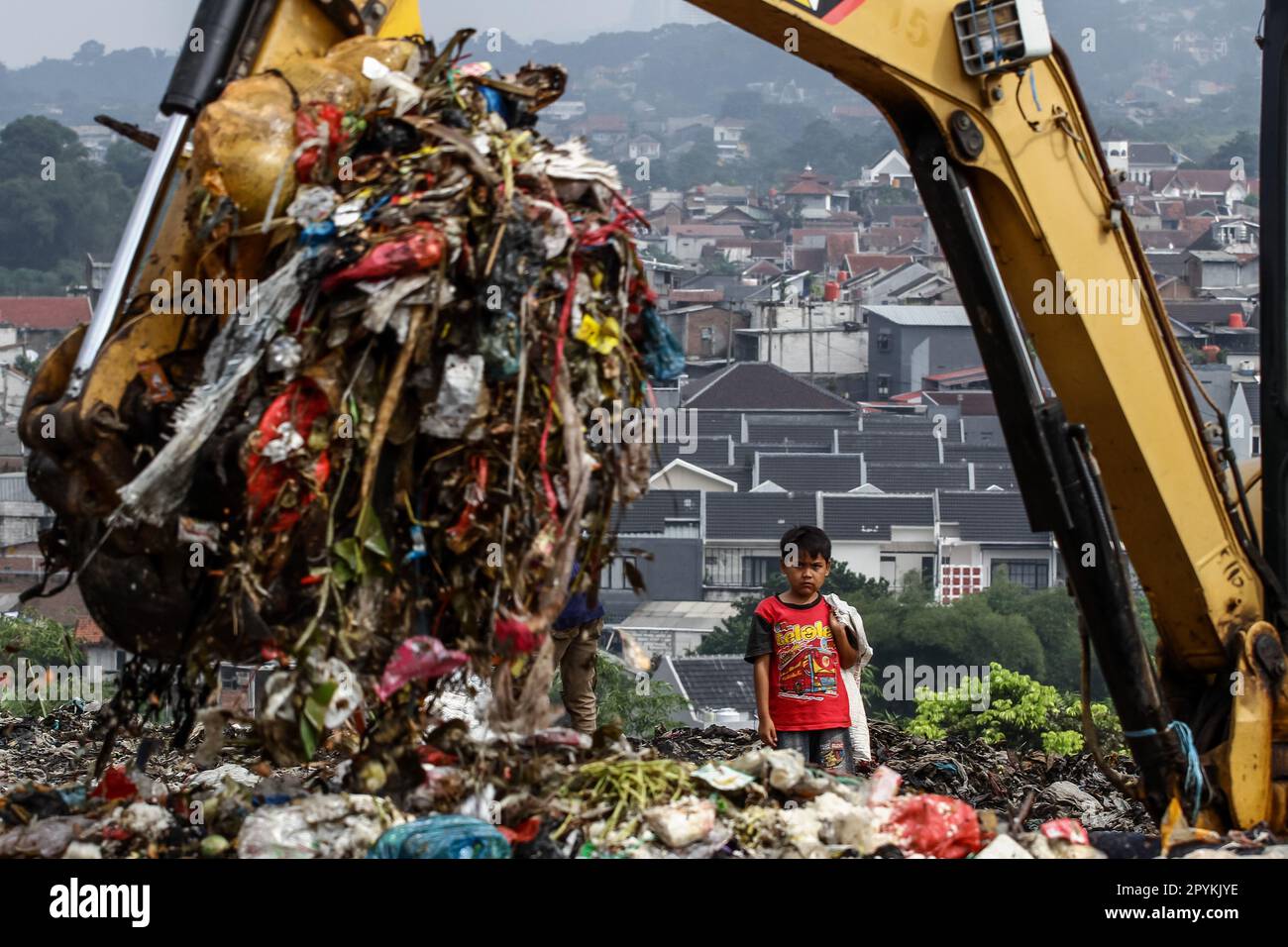 Bandung, West Java, Indonesia. 4th May, 2023. A scavenger picks trash ...