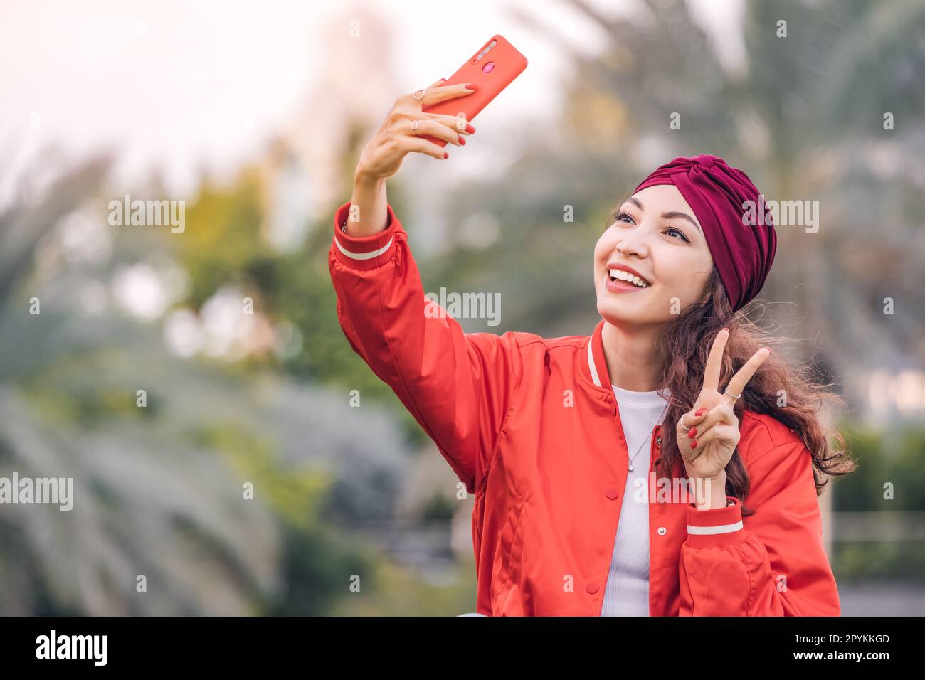 Happy malaysian girl influencer taking selfie photos for her social ...