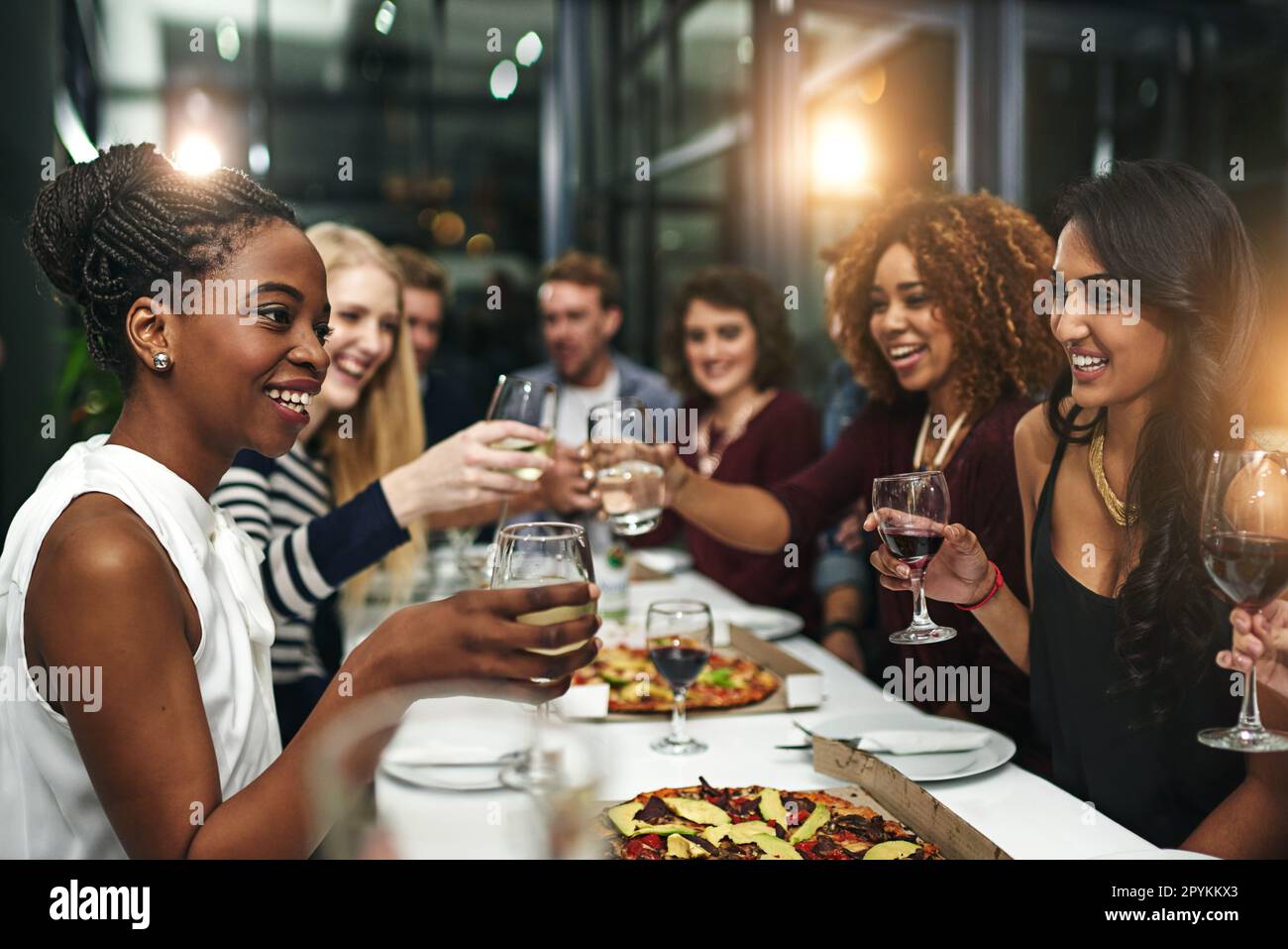 Food, party and wine with friends at restaurant for celebration, pizza ...