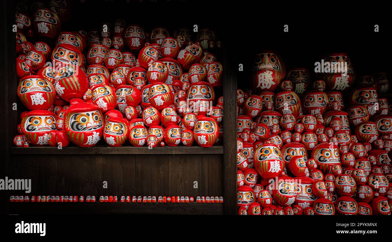 A shelf of Daruma dolls, in Osaka's Katusoji temple Stock Photo - Alamy
