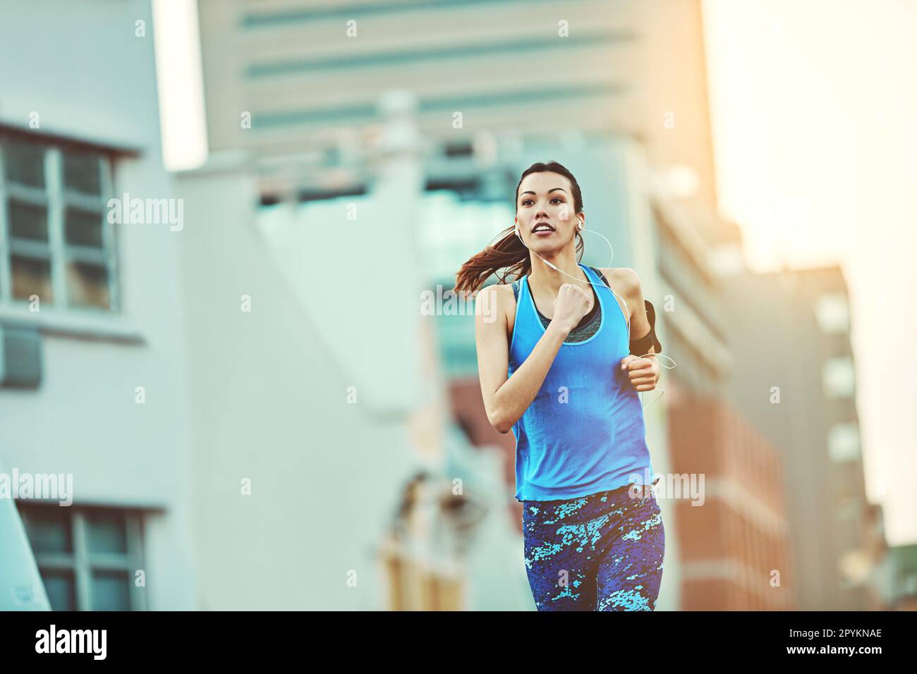 Make the right choices for you. a young woman out in the city for her morning run Stock Photo ...