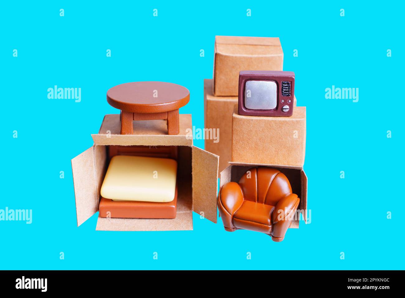 Miniature toy models of essential home furniture items packed in tiny ...