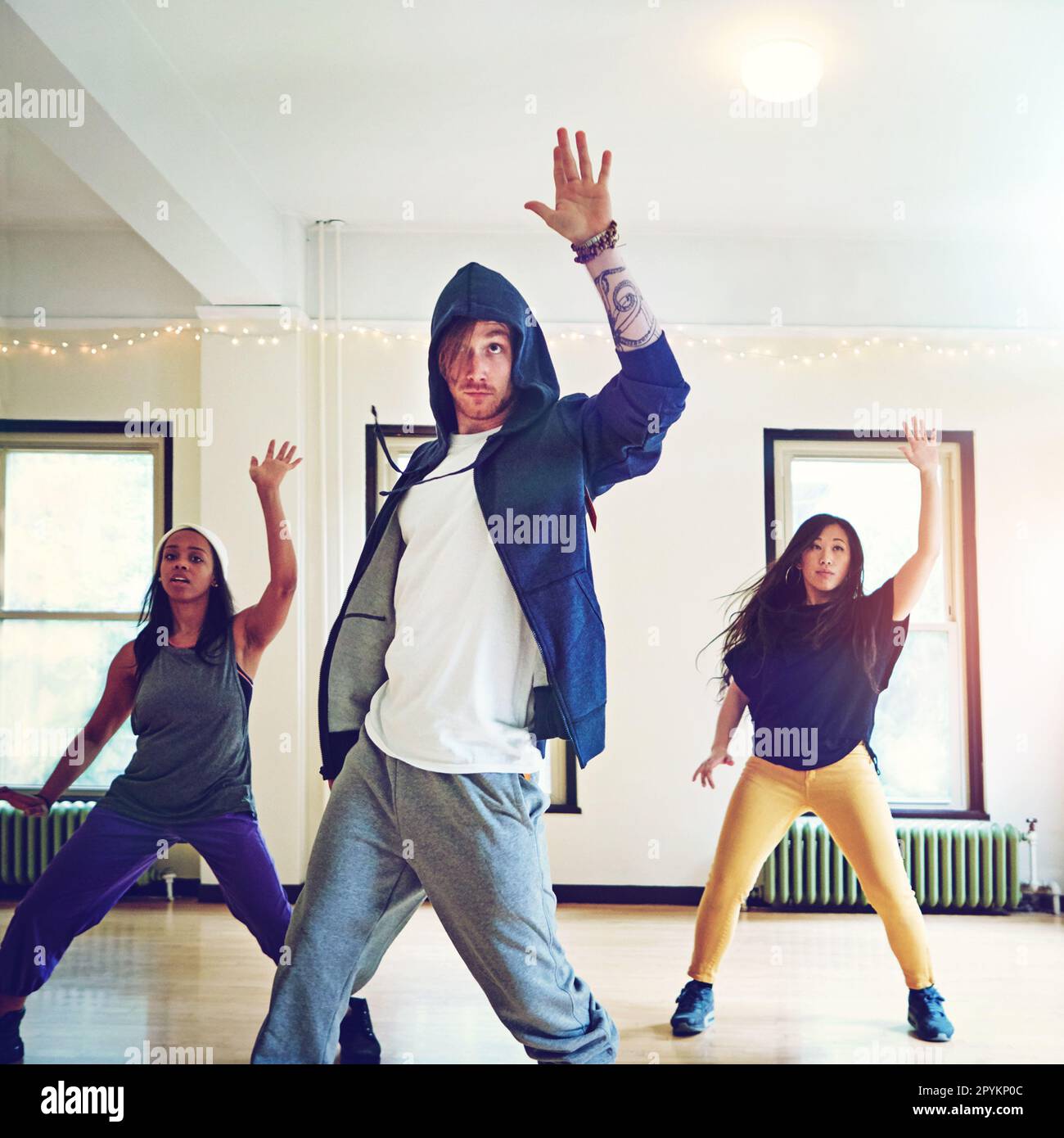 Rising dance stars. a group of young people dancing together in a ...