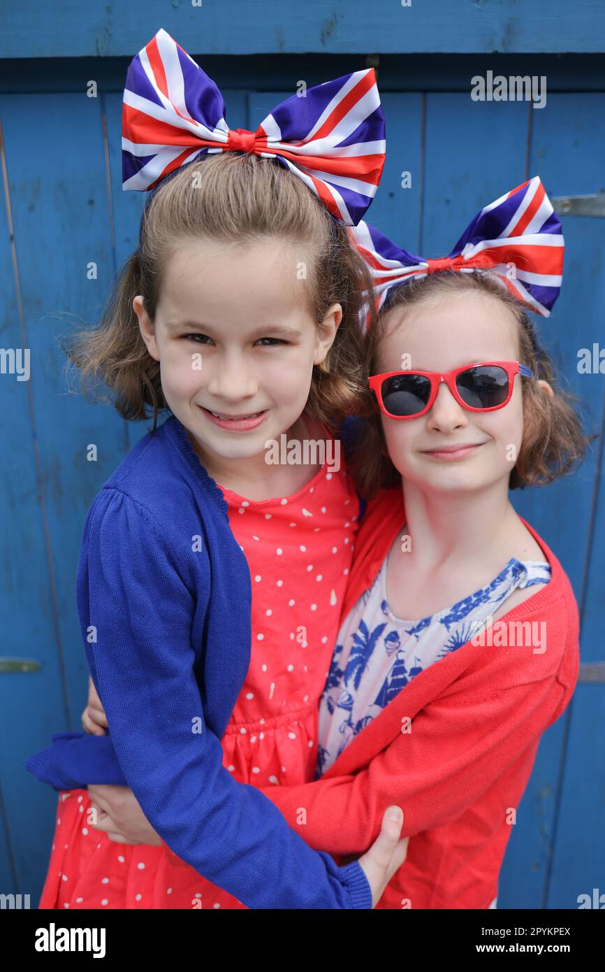 London, UK. May 4, 2023. Sisters Alice, aged 9 (left) and Lara Young ...
