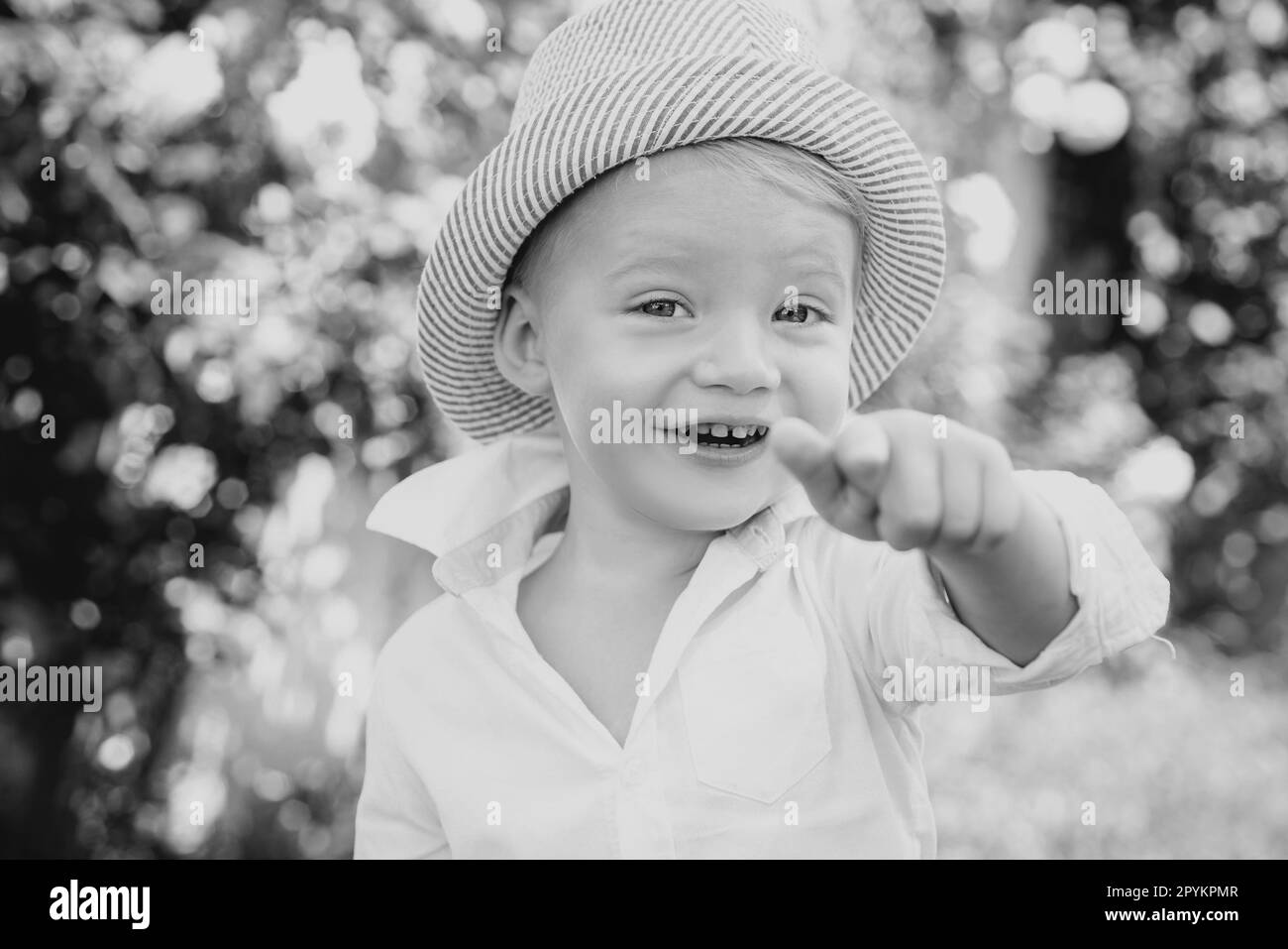 Portrait of cute boy smiling outdoors. Closeup headshot portrait of ...