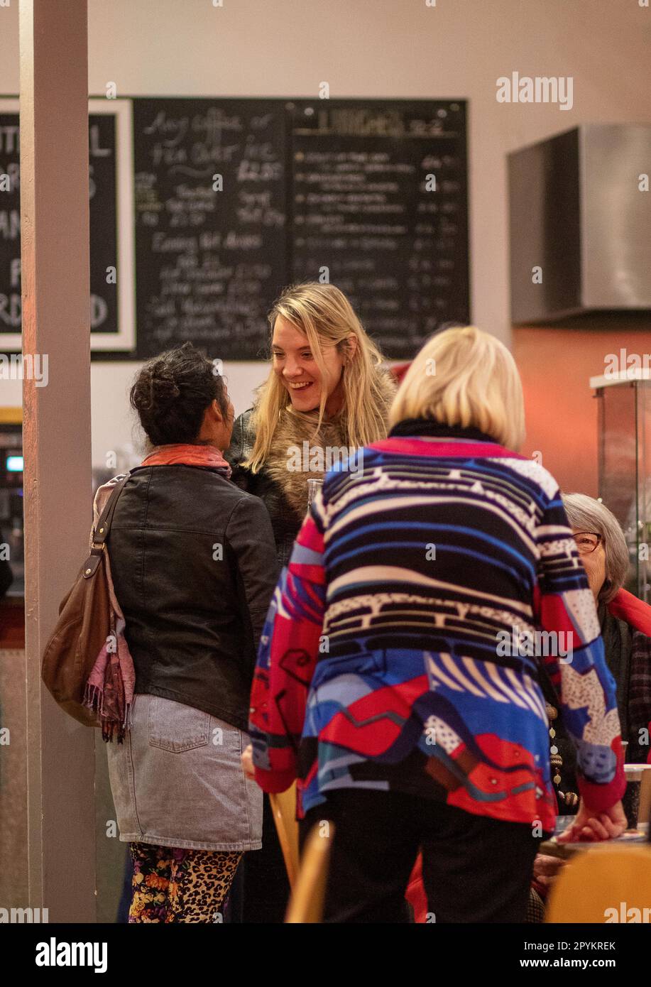A small group of women meeting up in an arts centre for a musical ...