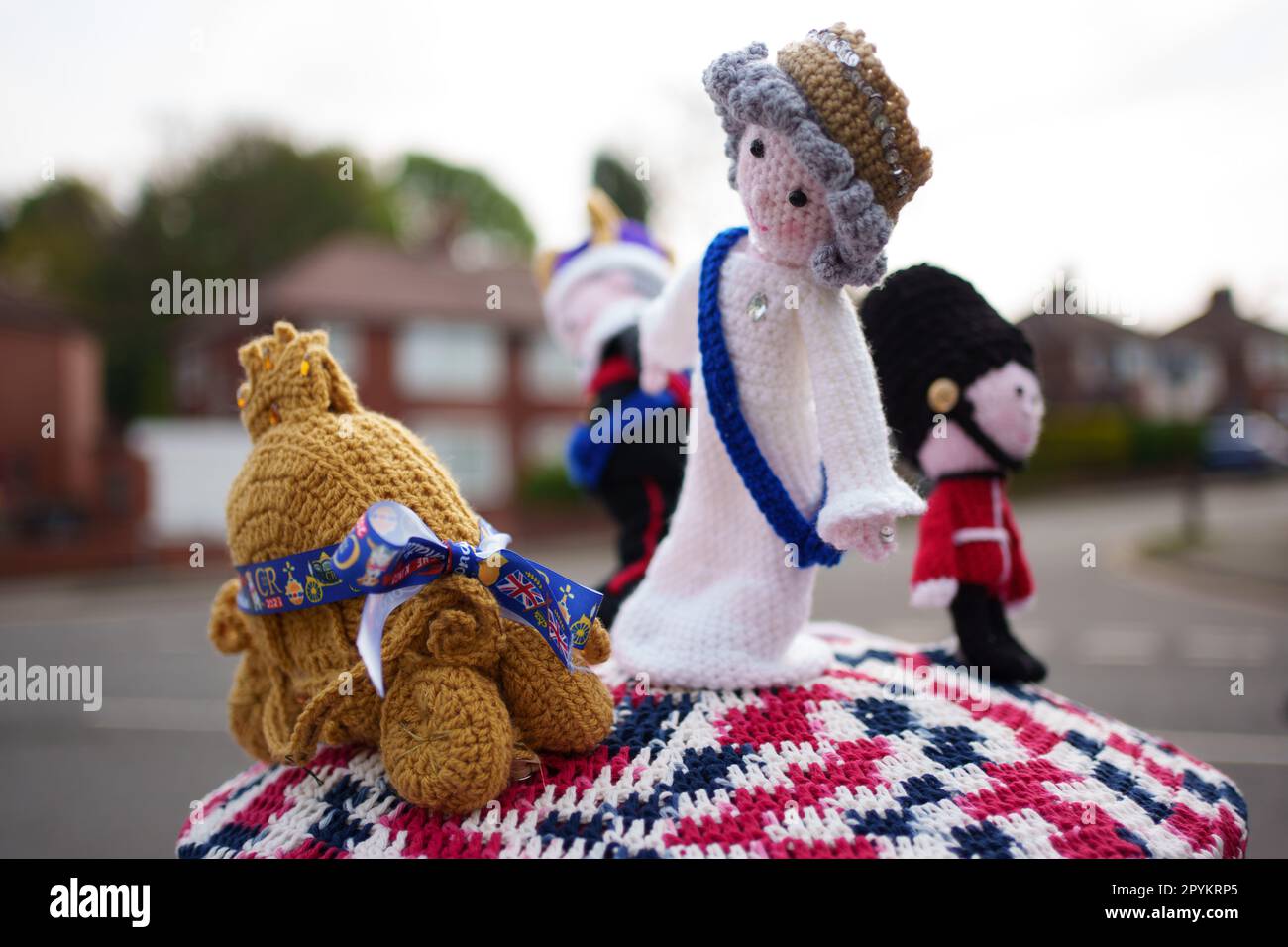 A knitted post box topper celebrating the coronation of King CharlesIII ...