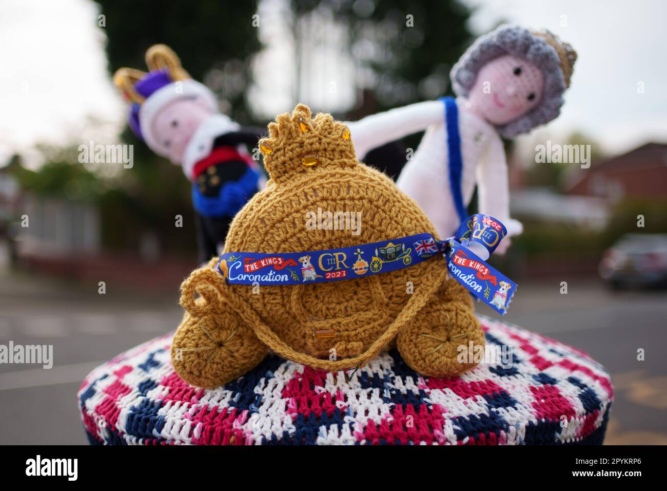 A knitted post box topper celebrating the coronation of King CharlesIII ...