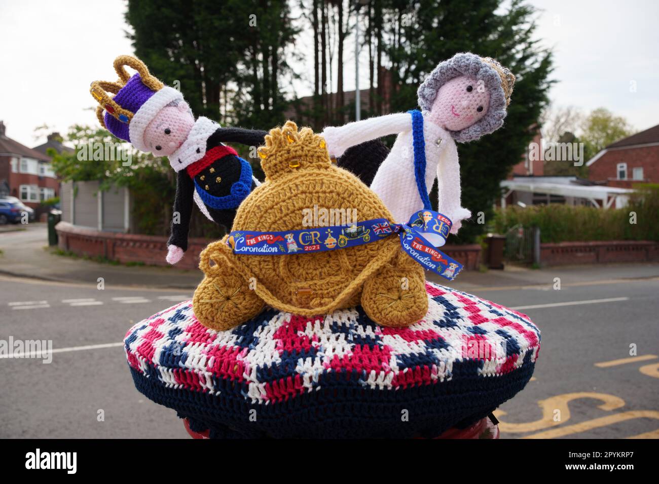 A knitted post box topper celebrating the coronation of King CharlesIII ...