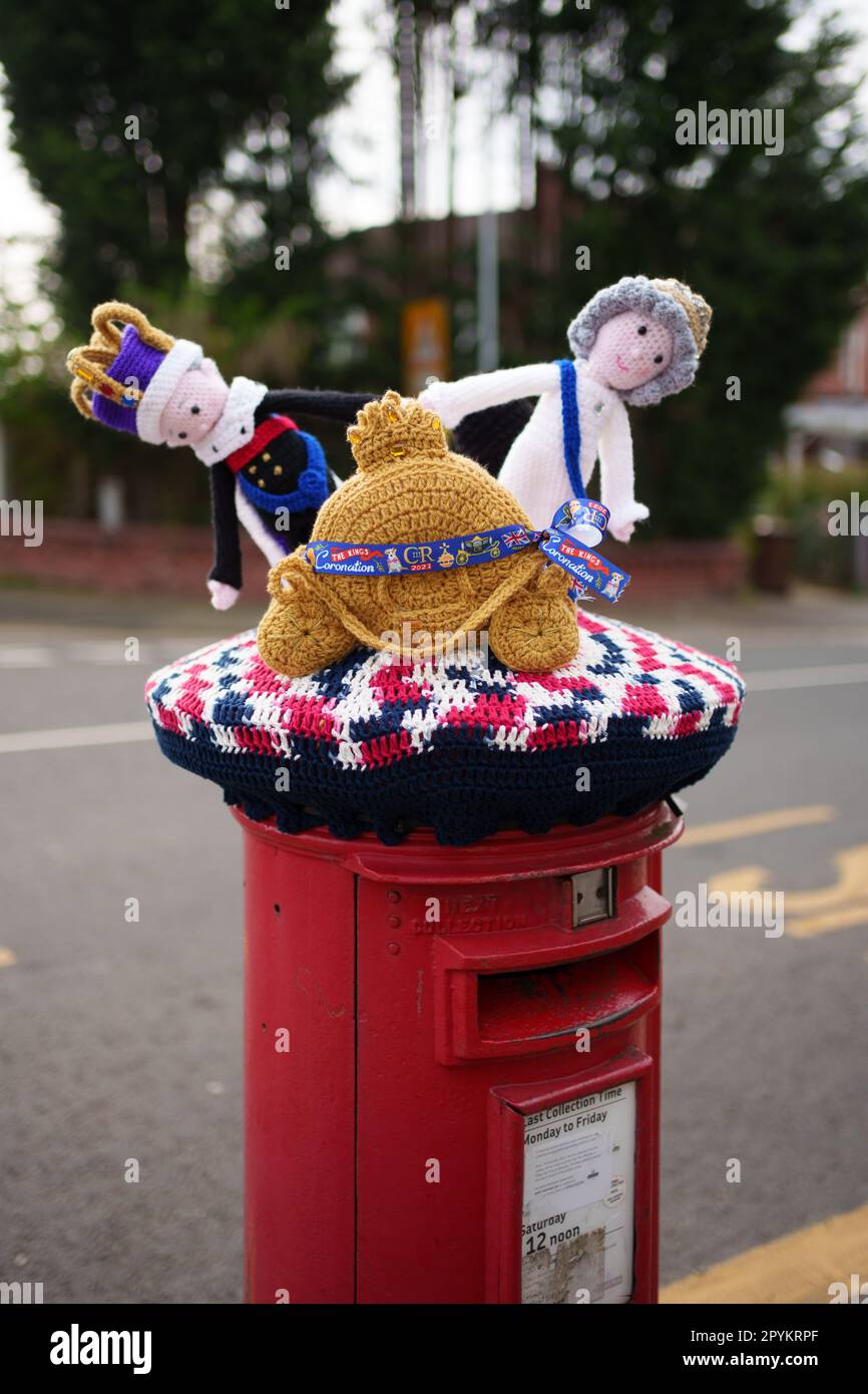 A knitted post box topper celebrating the coronation of King CharlesIII ...