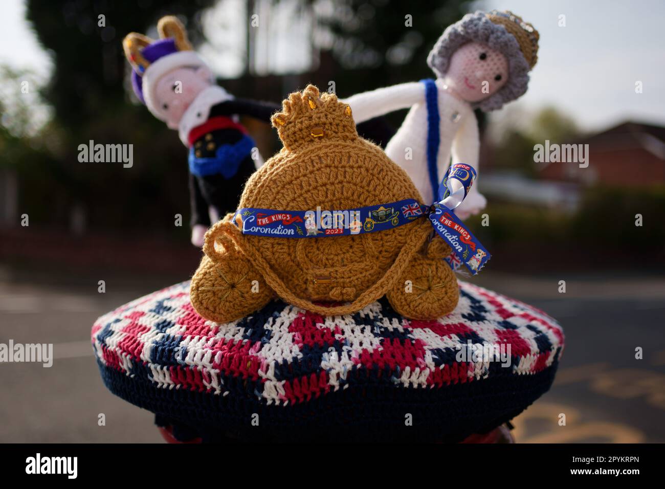 A knitted post box topper celebrating the coronation of King CharlesIII ...