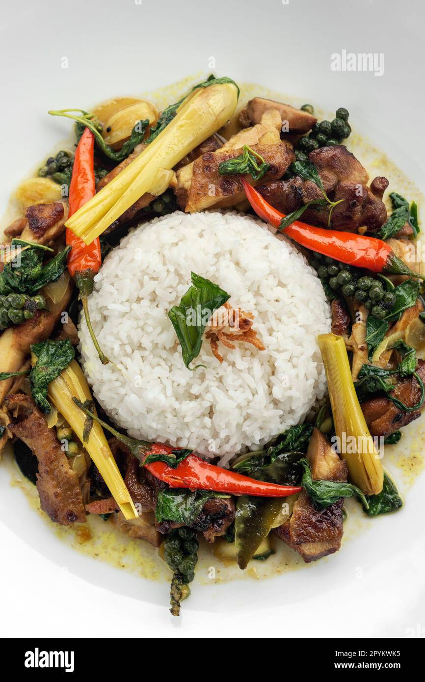 Pad Krapow Gai spicy Thai Chicken Vegetable Stir Fry on white plate ...