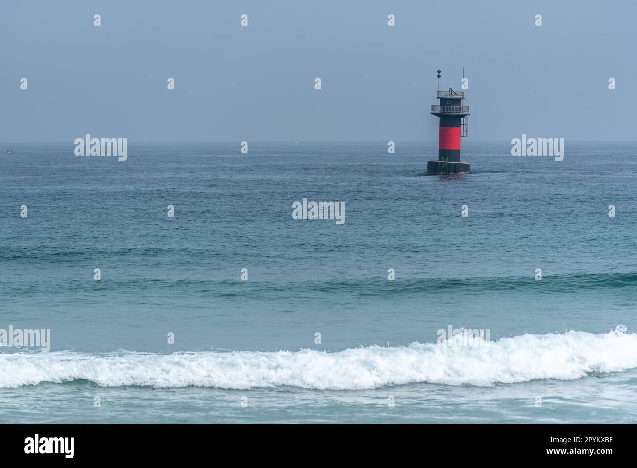 A small lighthouse in the middle of the ocean Stock Photo - Alamy