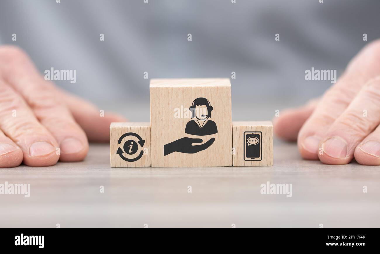 Wooden blocks with symbol of customer service concept Stock Photo - Alamy