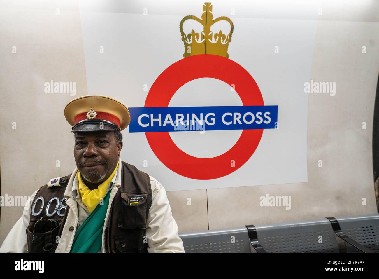 London UK. 4 May 2023. A commuter sits on front of the iconic roundel ...
