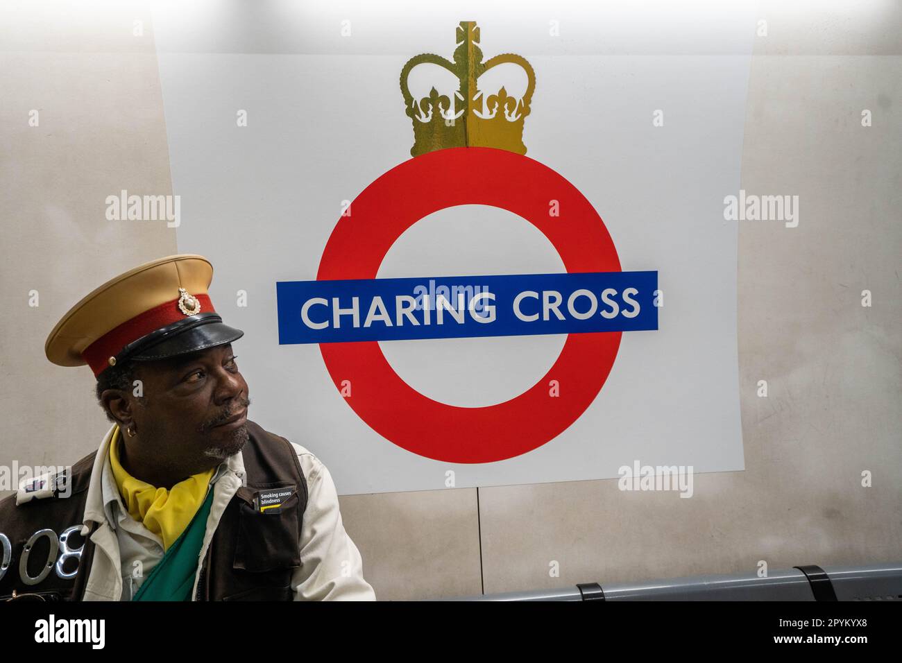 London UK. 4 May 2023. A commuter sits on front of the iconic roundel ...