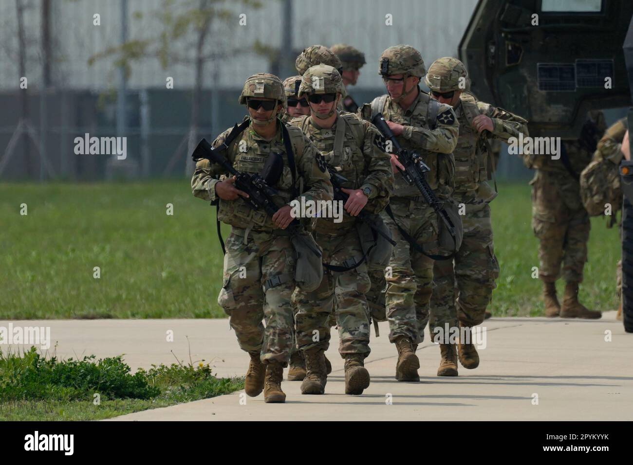 U.S. soldiers from the 2nd Infantry Division walk after disembarking ...