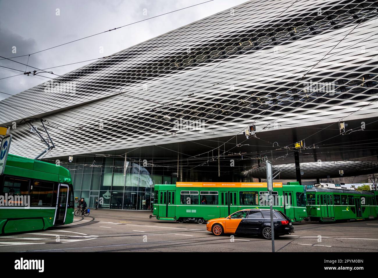 Tram passing through Basel exhibition centre, the new Messe Basel trade ...