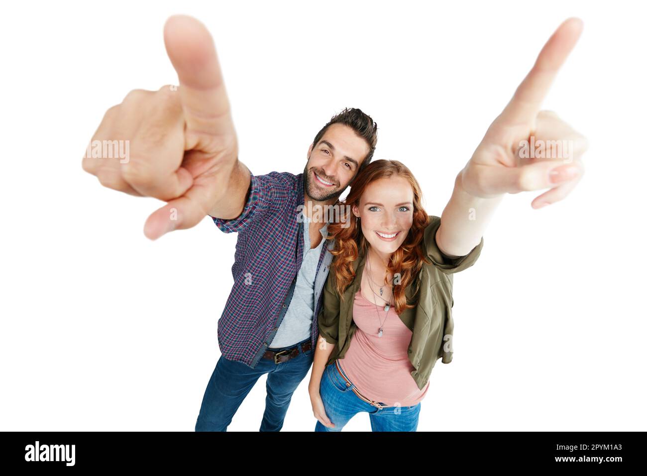 Take a look at that. a couple pointing against a white background Stock ...