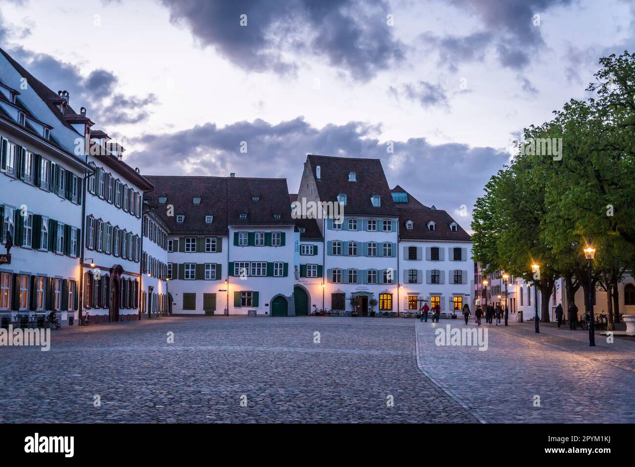 Minster Cathedral Square with old-world architecture at dusk, Basel ...