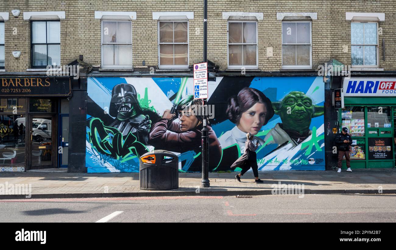 London, UK. 4 May 2023. People in Shoreditch pass a newly unveiled Star ...