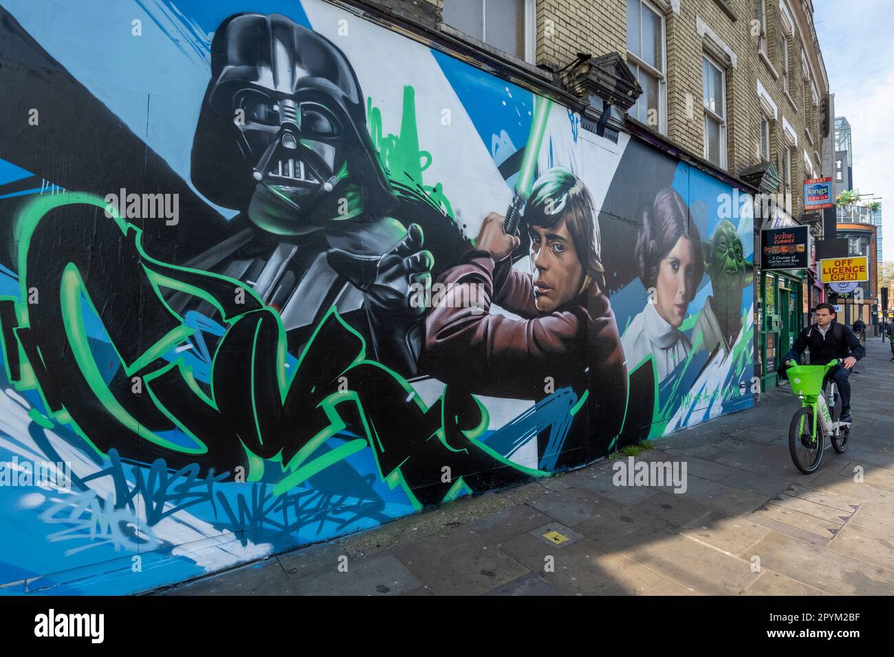 London, UK. 4 May 2023. People in Shoreditch pass a newly unveiled Star ...
